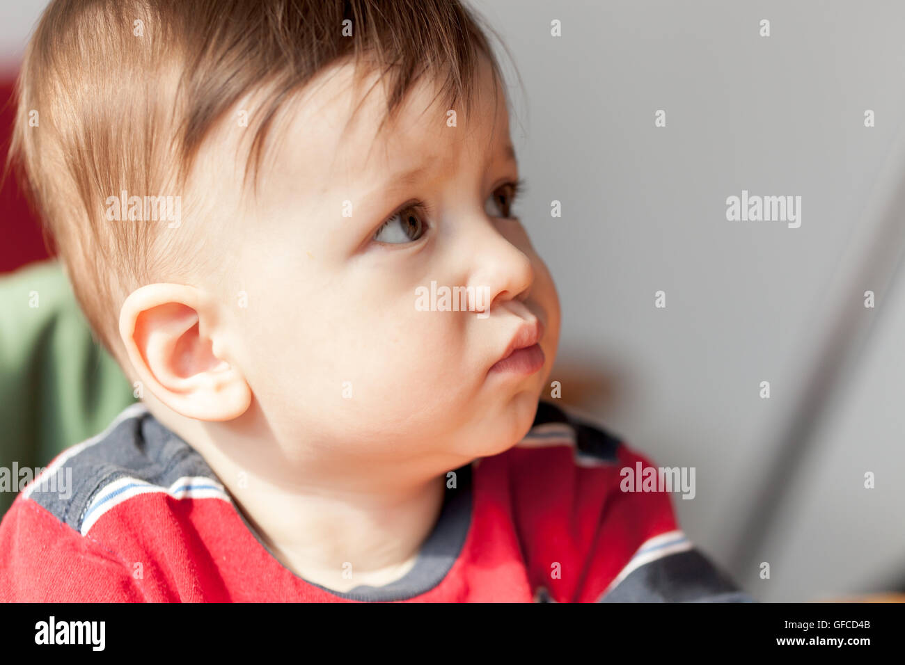 Close-up of a boy thinking Stock Photo - Alamy