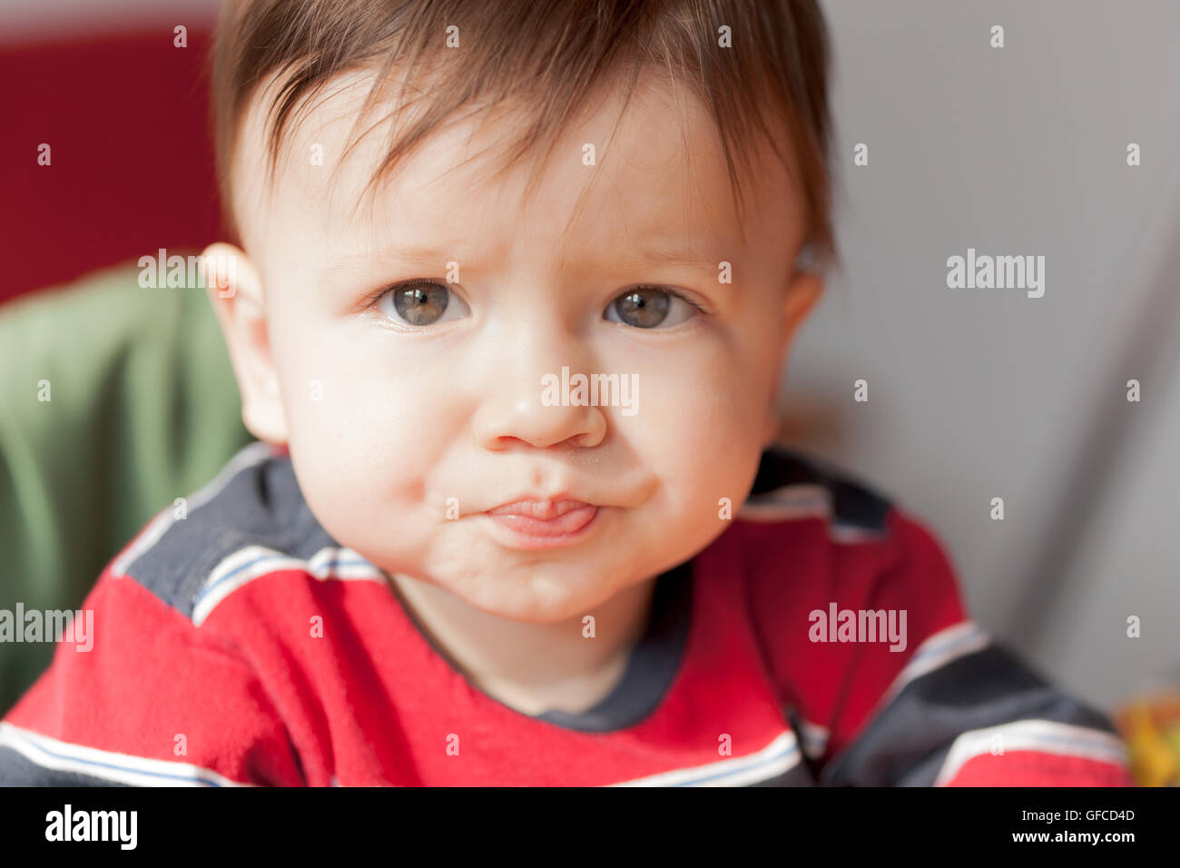 Portrait of a boy puckering Stock Photo - Alamy