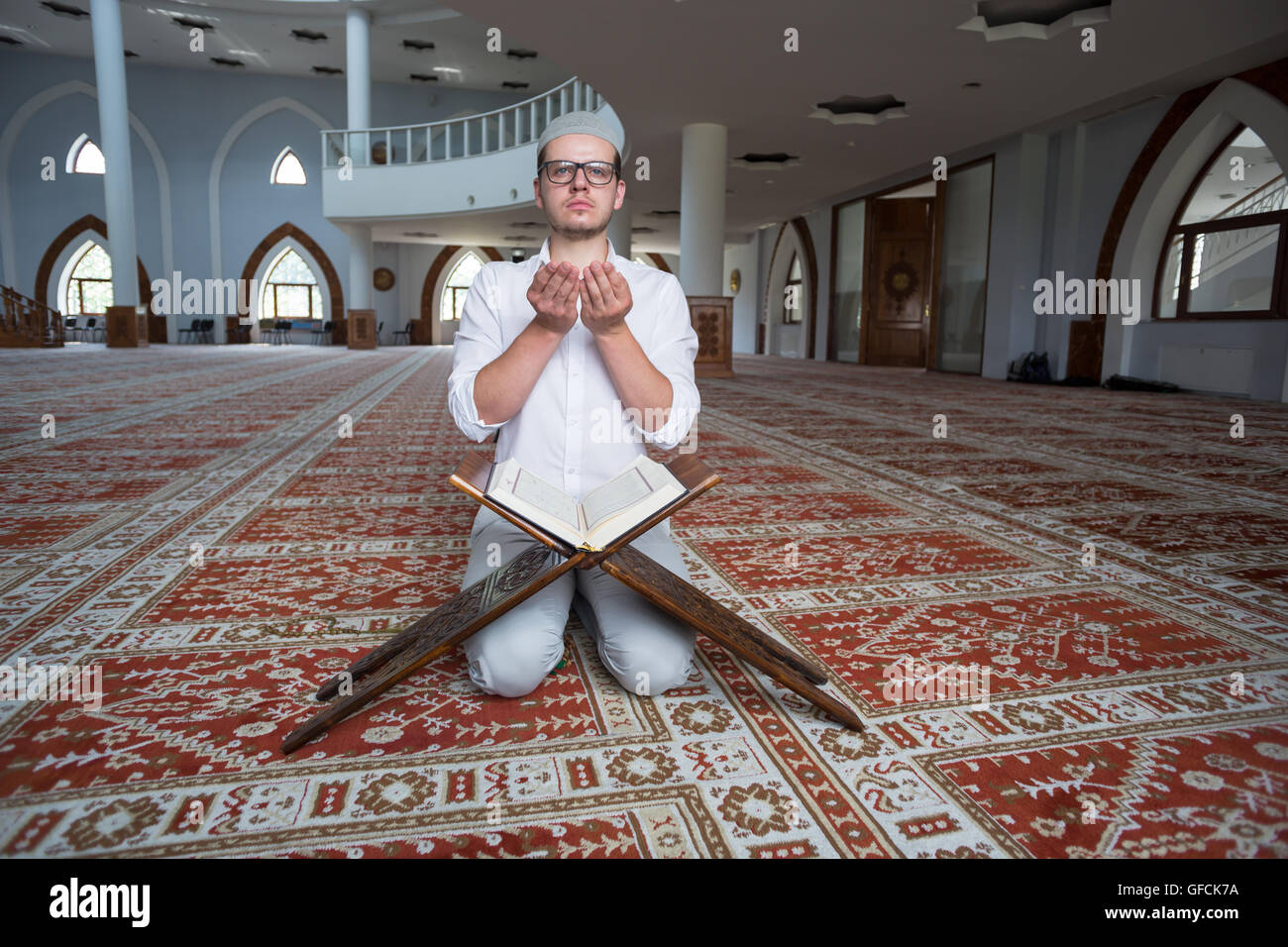 Young muslim man is praying in the mosque Stock Photo - Alamy