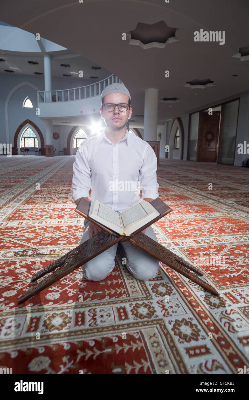 Religious muslim man praying inside the mosque Stock Photo - Alamy