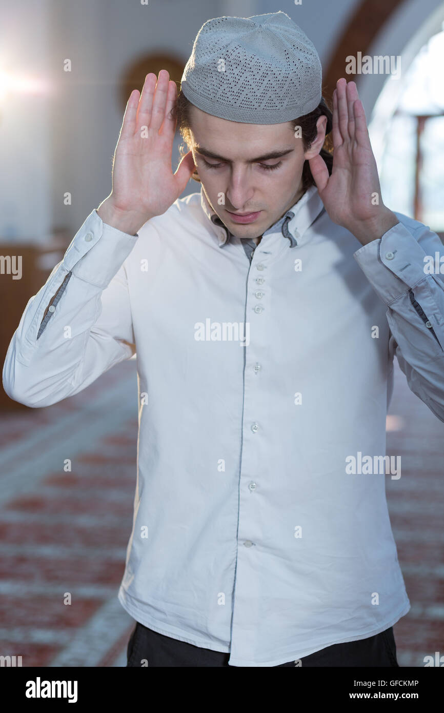 Religious muslim man praying, steps of praying Stock Photo - Alamy