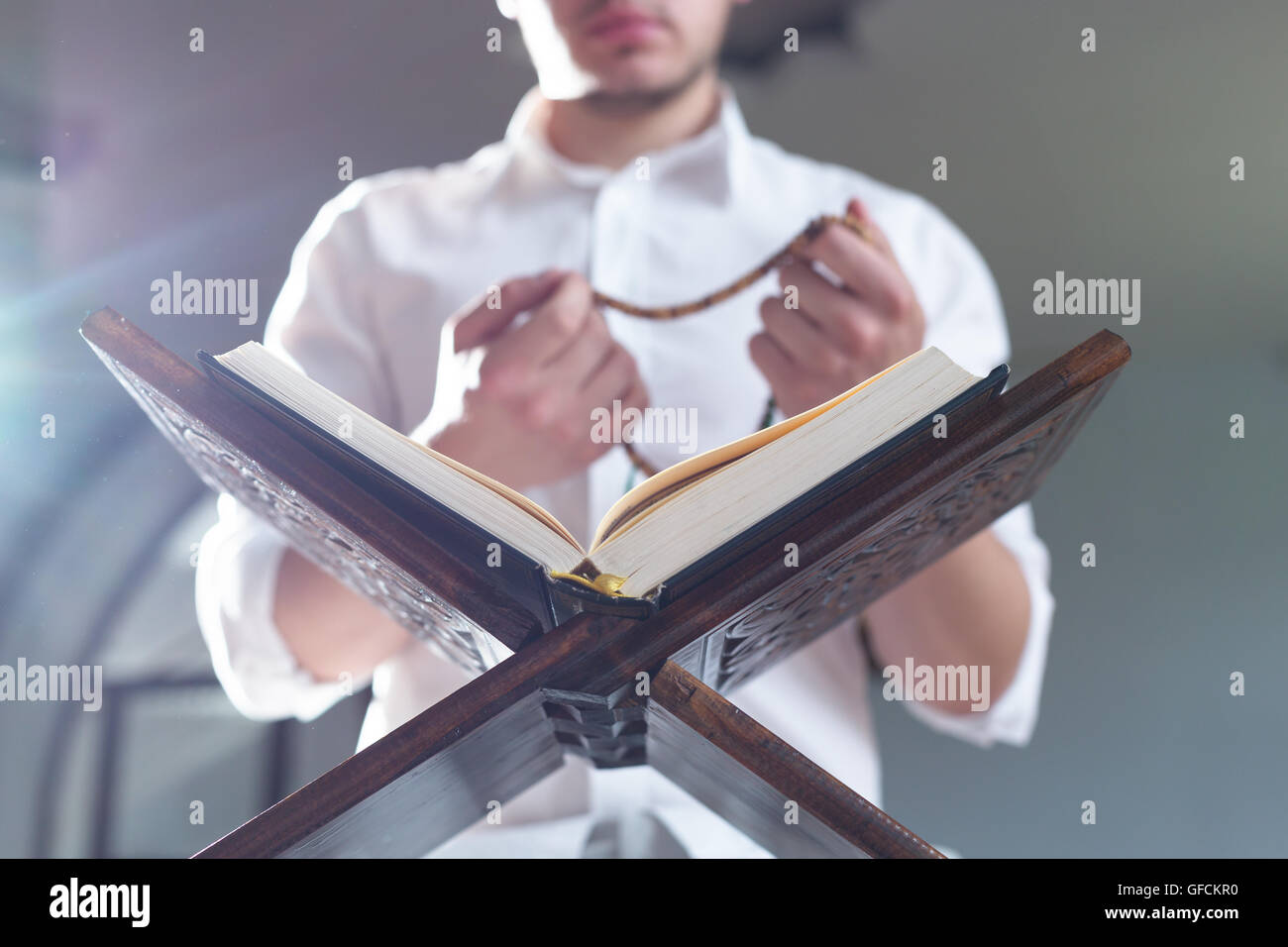 Young Muslim Man Reading The Koran Stock Photo - Alamy