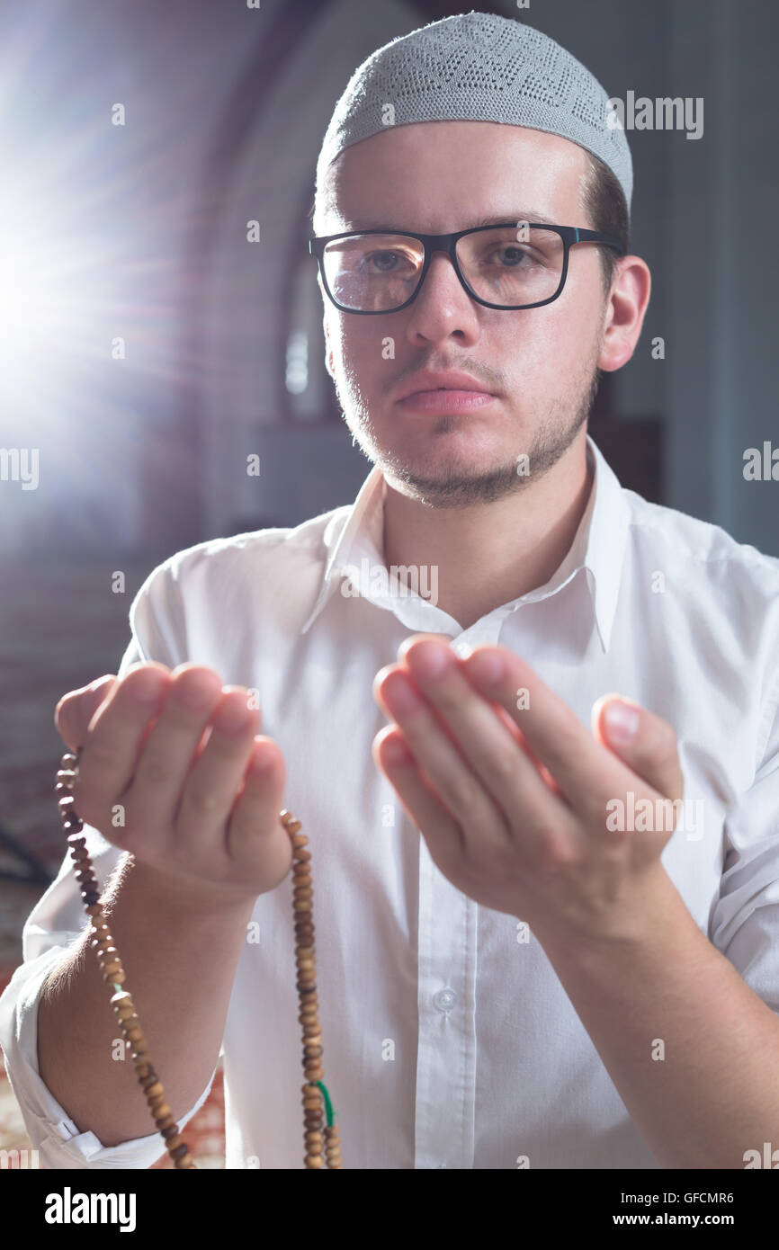 Religious muslim man praying inside the mosque Stock Photo - Alamy