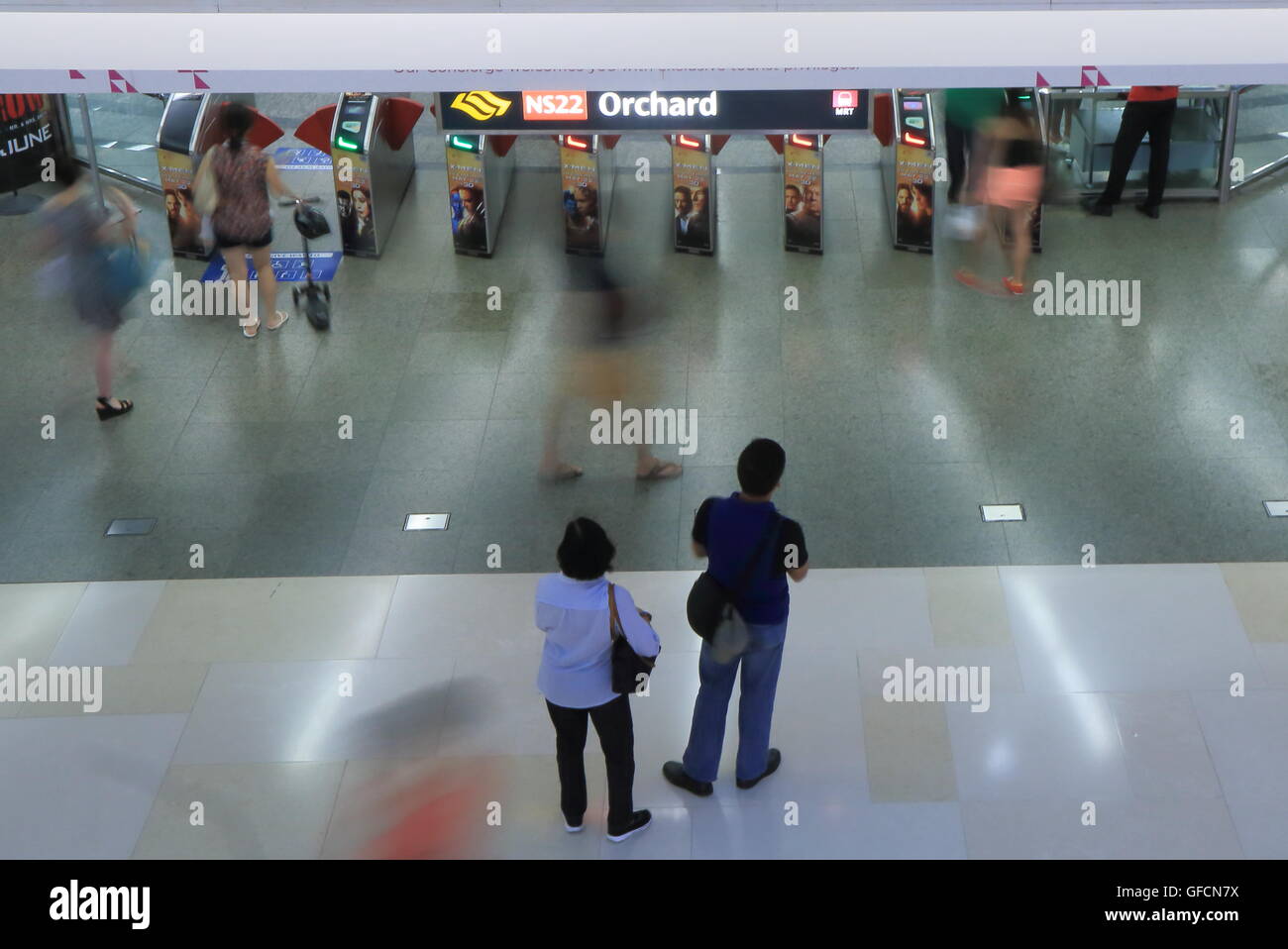 People commute at Orchard MRT station in Singapore Stock Photo - Alamy