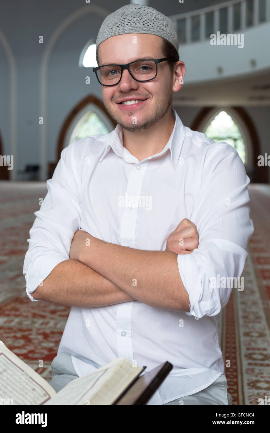 Religious muslim man praying inside the mosque Stock Photo - Alamy