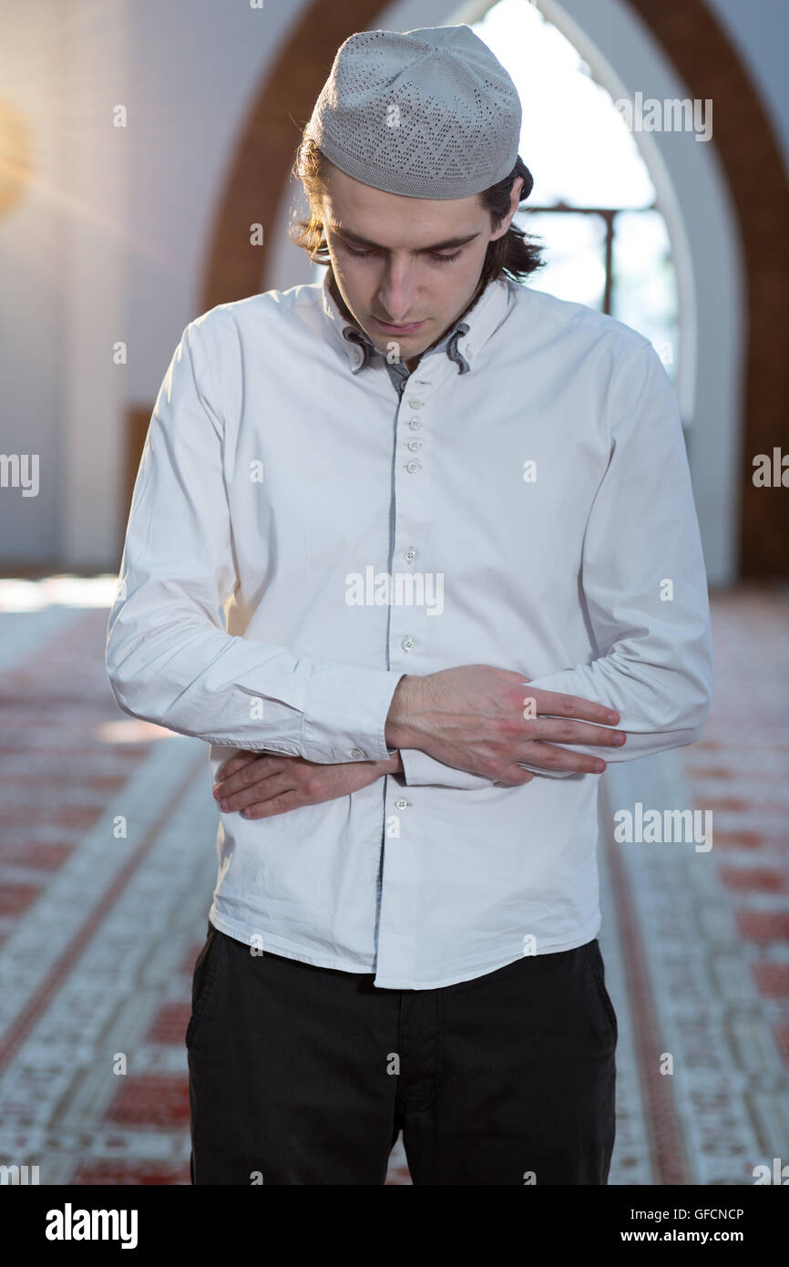 Religious muslim man praying, steps of praying Stock Photo - Alamy