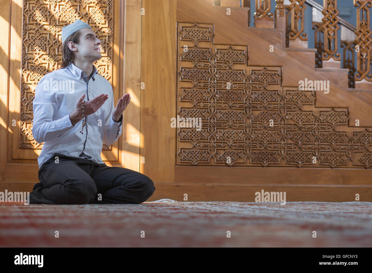 Young muslim man is praying in the mosque Stock Photo - Alamy
