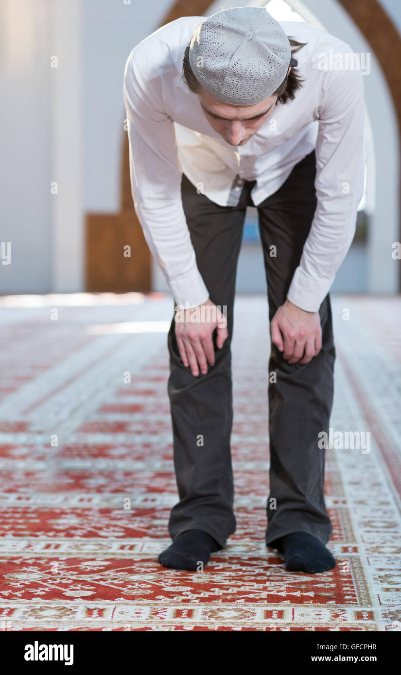 Religious muslim man praying, steps of praying Stock Photo - Alamy