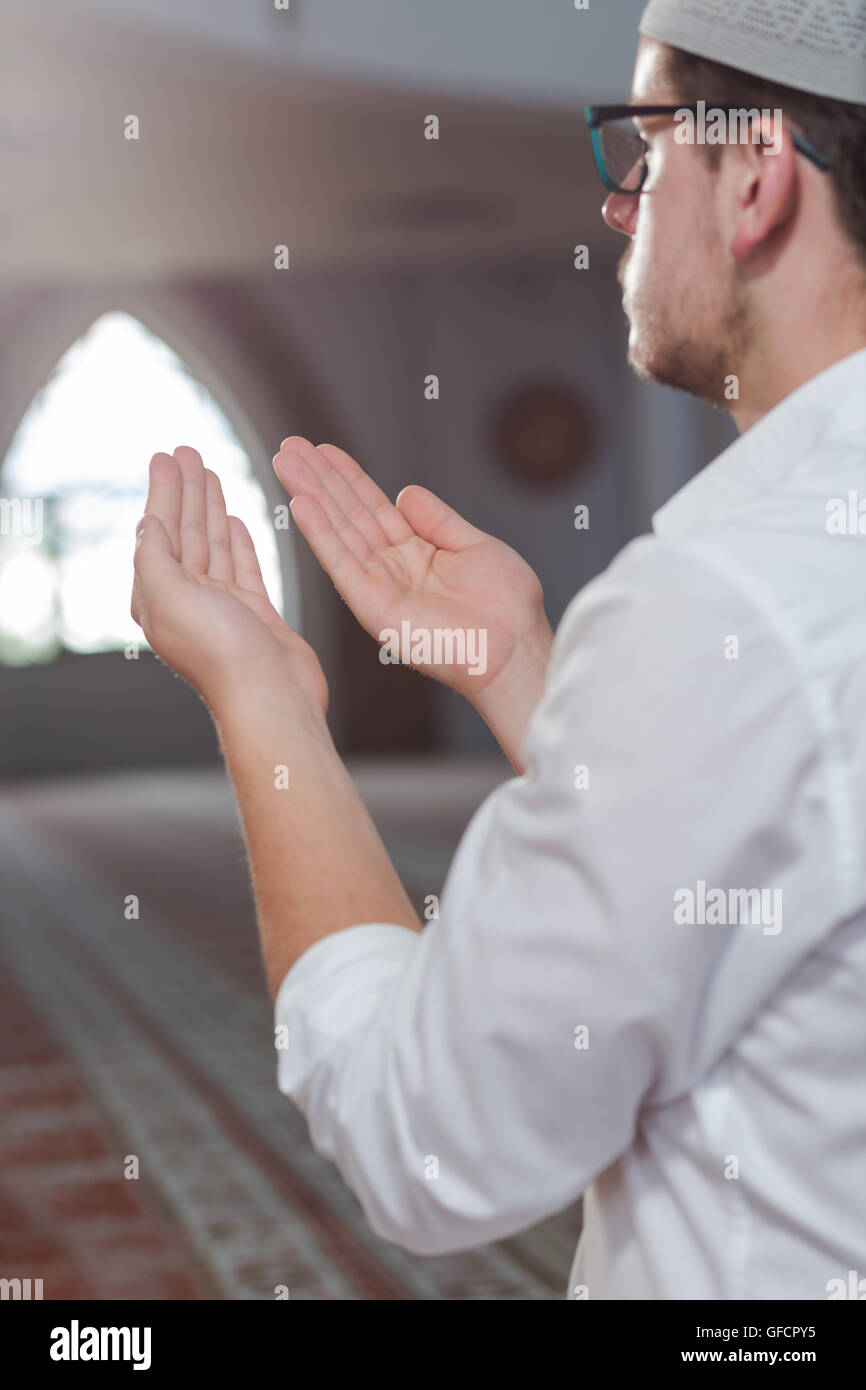 Religious muslim man praying inside the mosque Stock Photo - Alamy