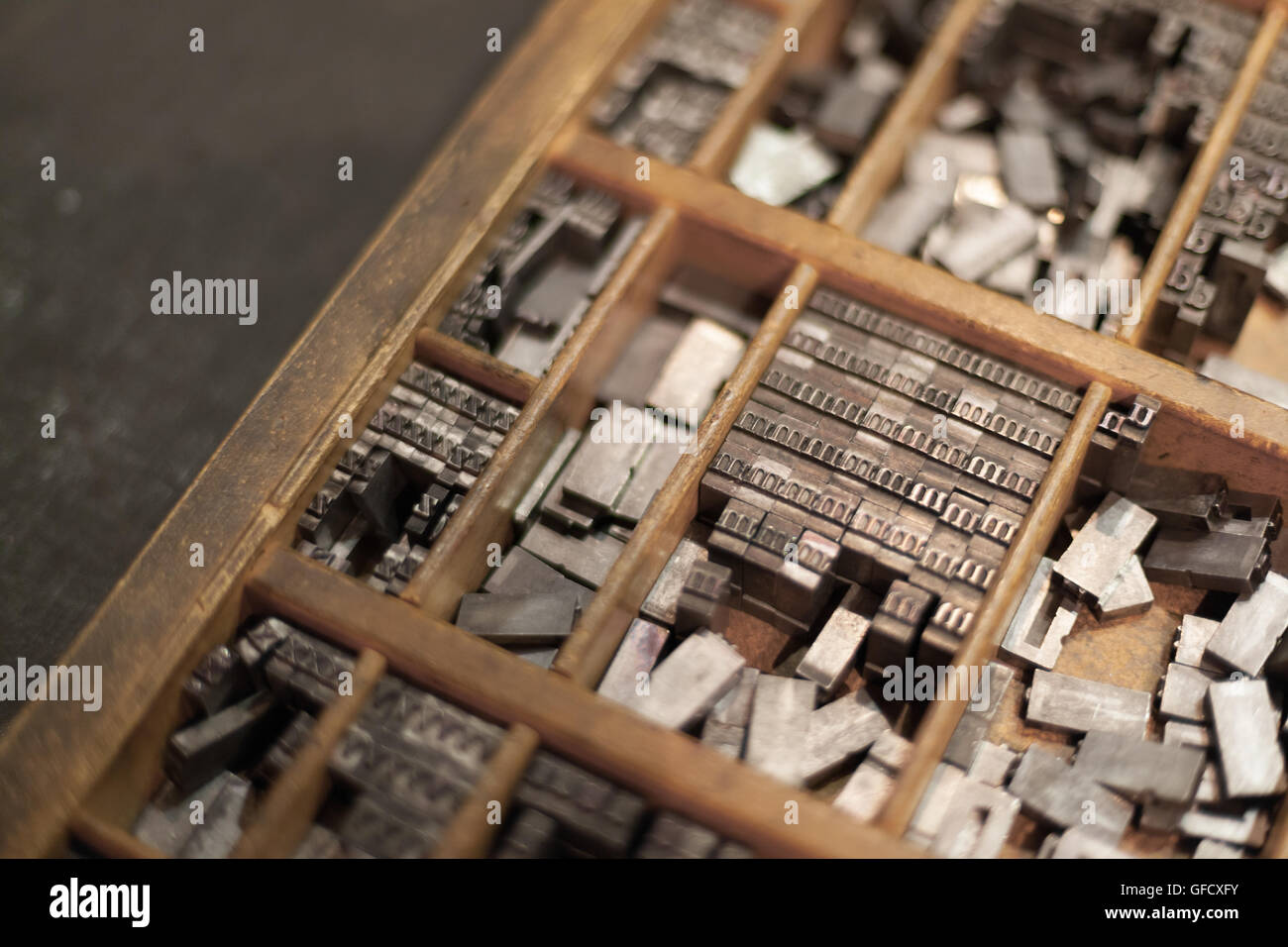 Close-up of metal letterpress letters in printing machinecolor image ...