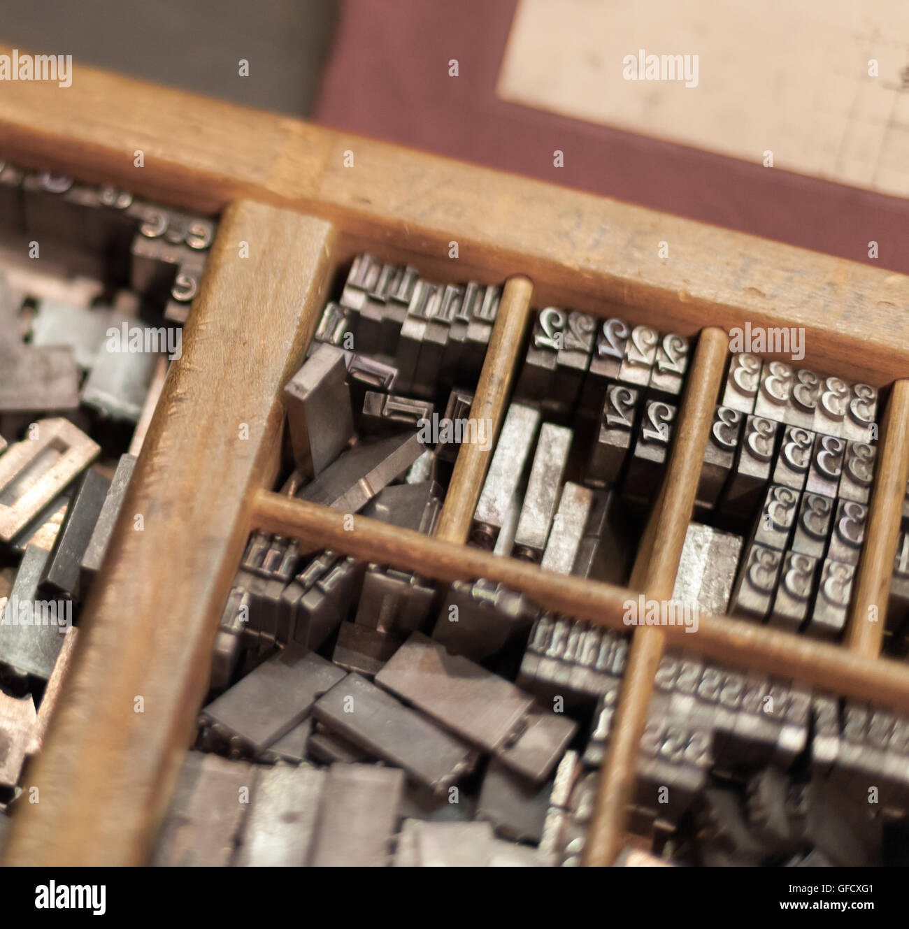 Close-up of metal letterpress letters in printing machinecolor image ...