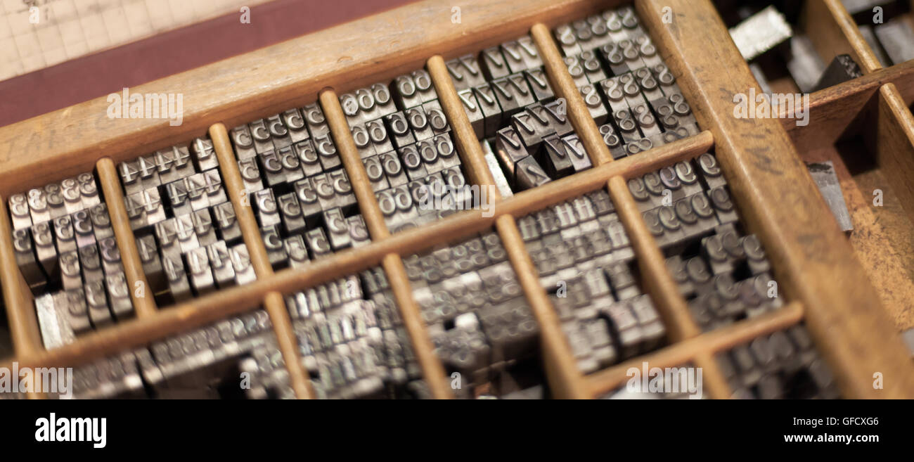 Close-up of metal letterpress letters in printing machinecolor image ...