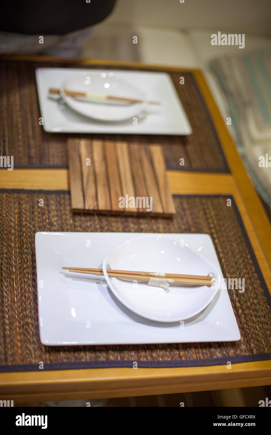 Dining table with Chinese place setting in a yachtcolor image, canon ...