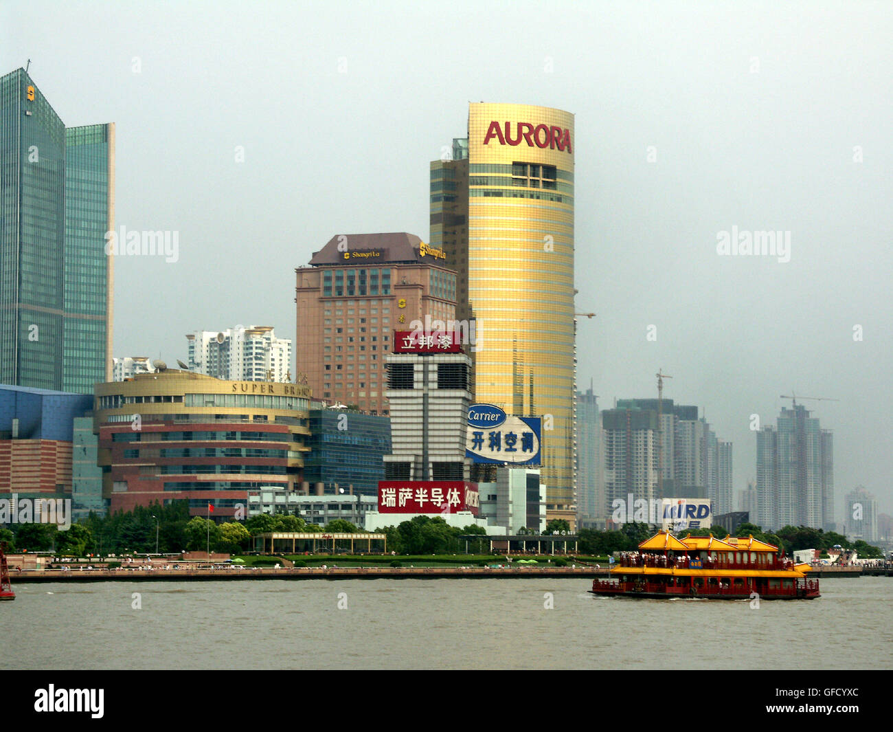 The “Wonderful Shanghai” cruise boat against the skyline of Shanghai’s ...