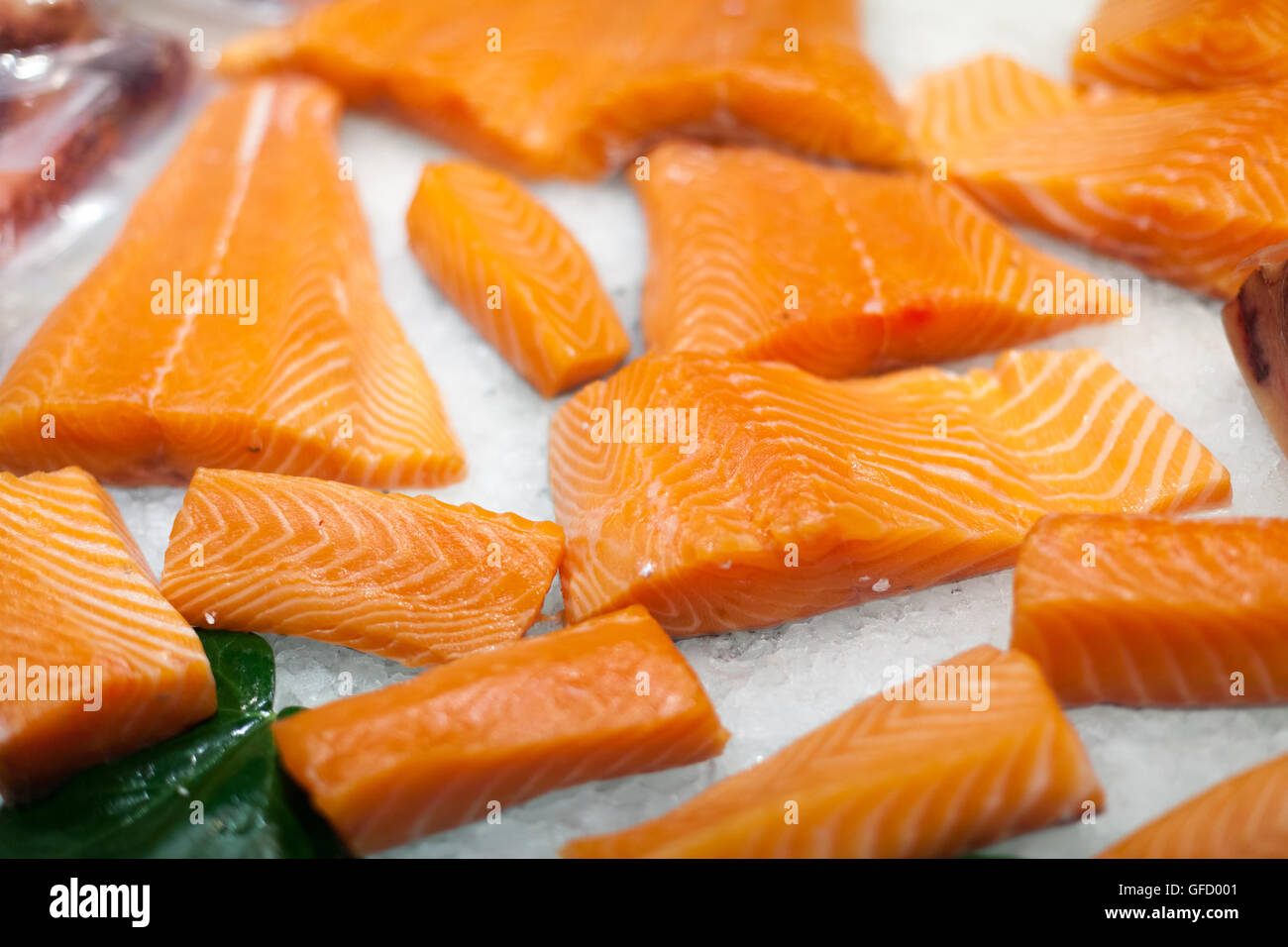 Display of frozen salmon slices for sale at a market stall, La Boqueria ...
