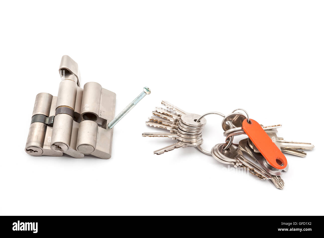 three different cylinders on white with screws and keys Stock Photo - Alamy