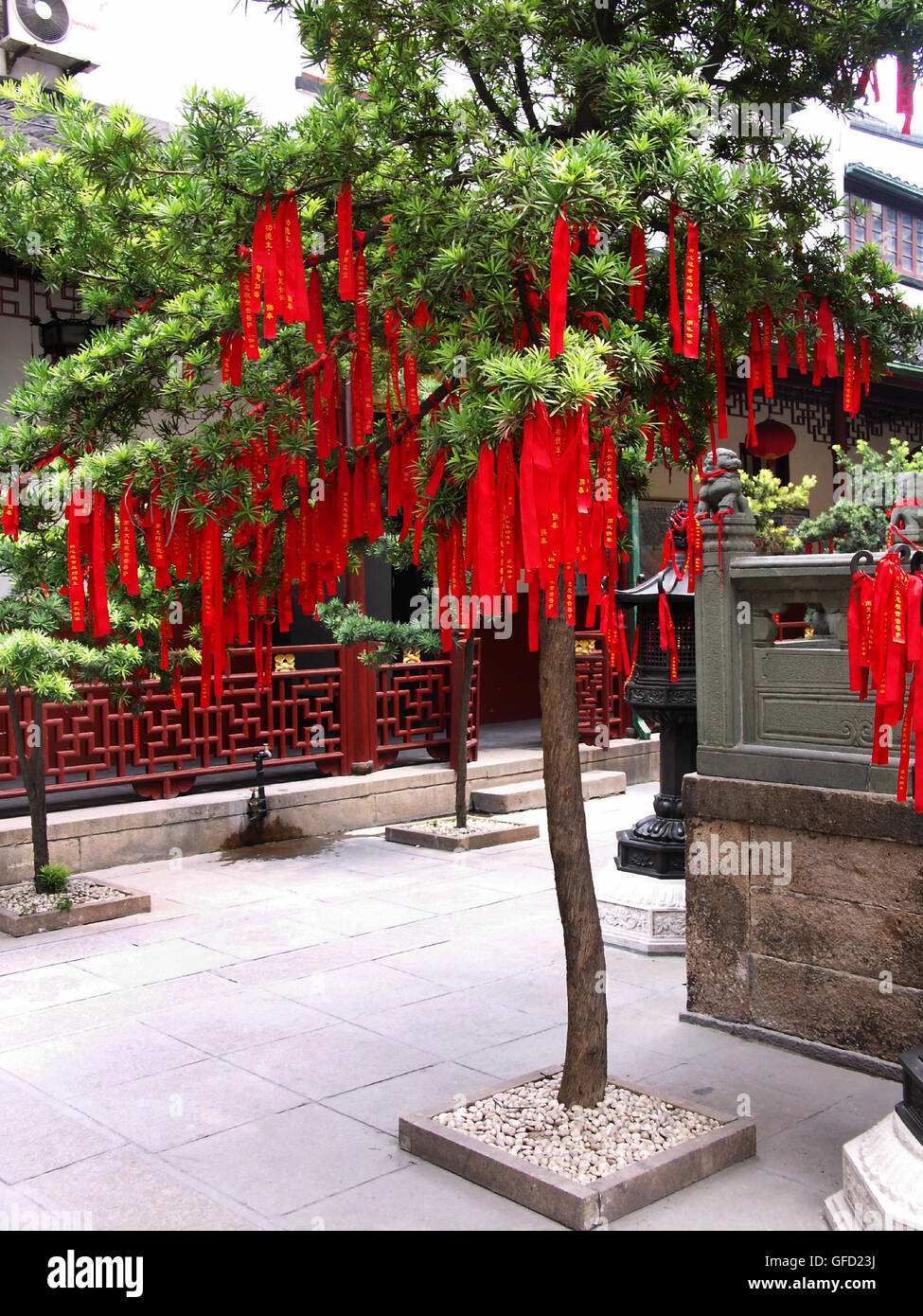 Prayer ribbons on trees in a garden at the Temple of the Jade Buddha in ...