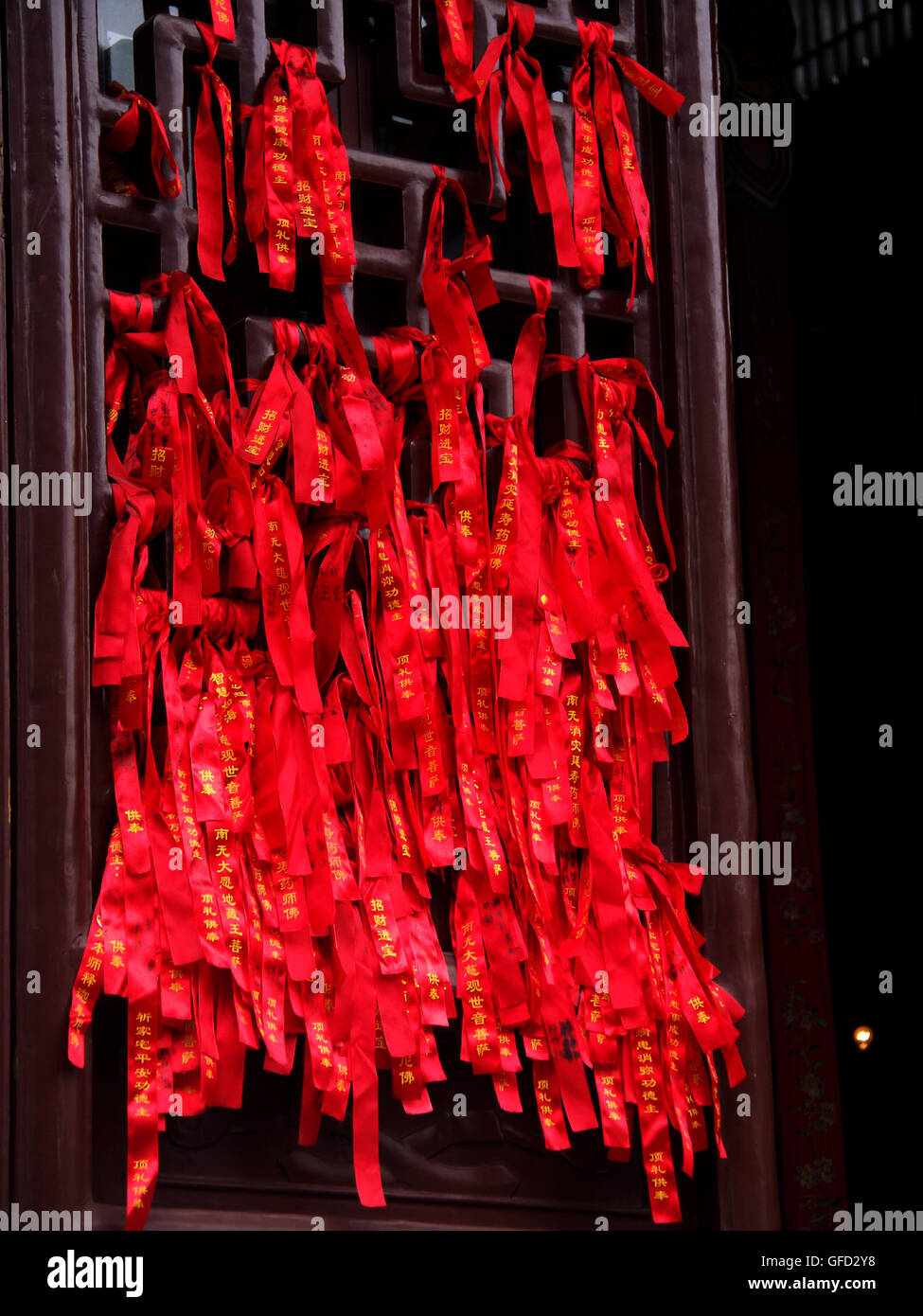 Prayer ribbons tied to a window of the Temple of the Jade Buddha in ...