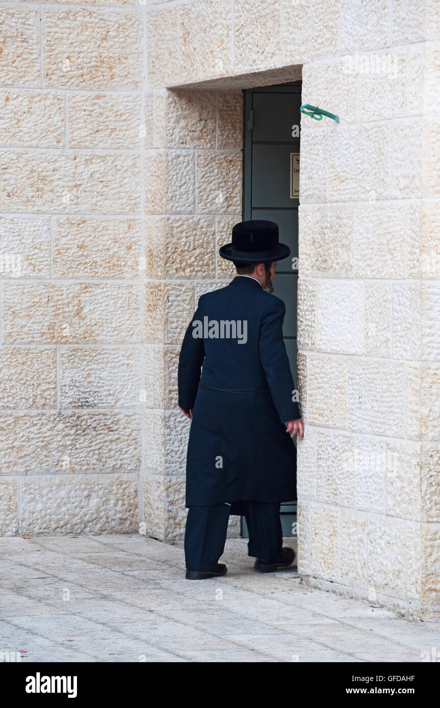 Jerusalem, Israel: an Orthodox Jew child entering a public lavatory ...
