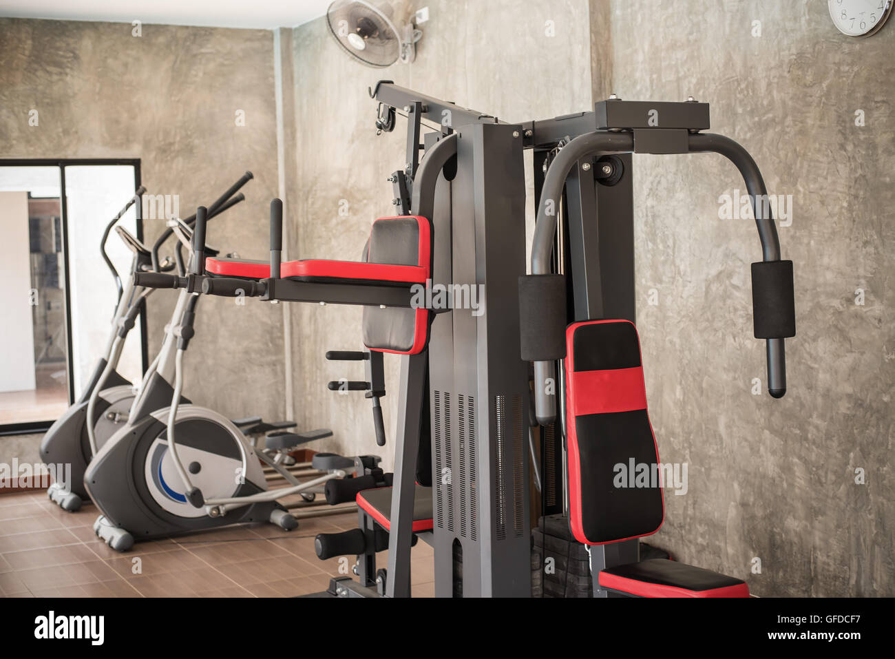 diverse equipment and machines at the gym room Stock Photo - Alamy