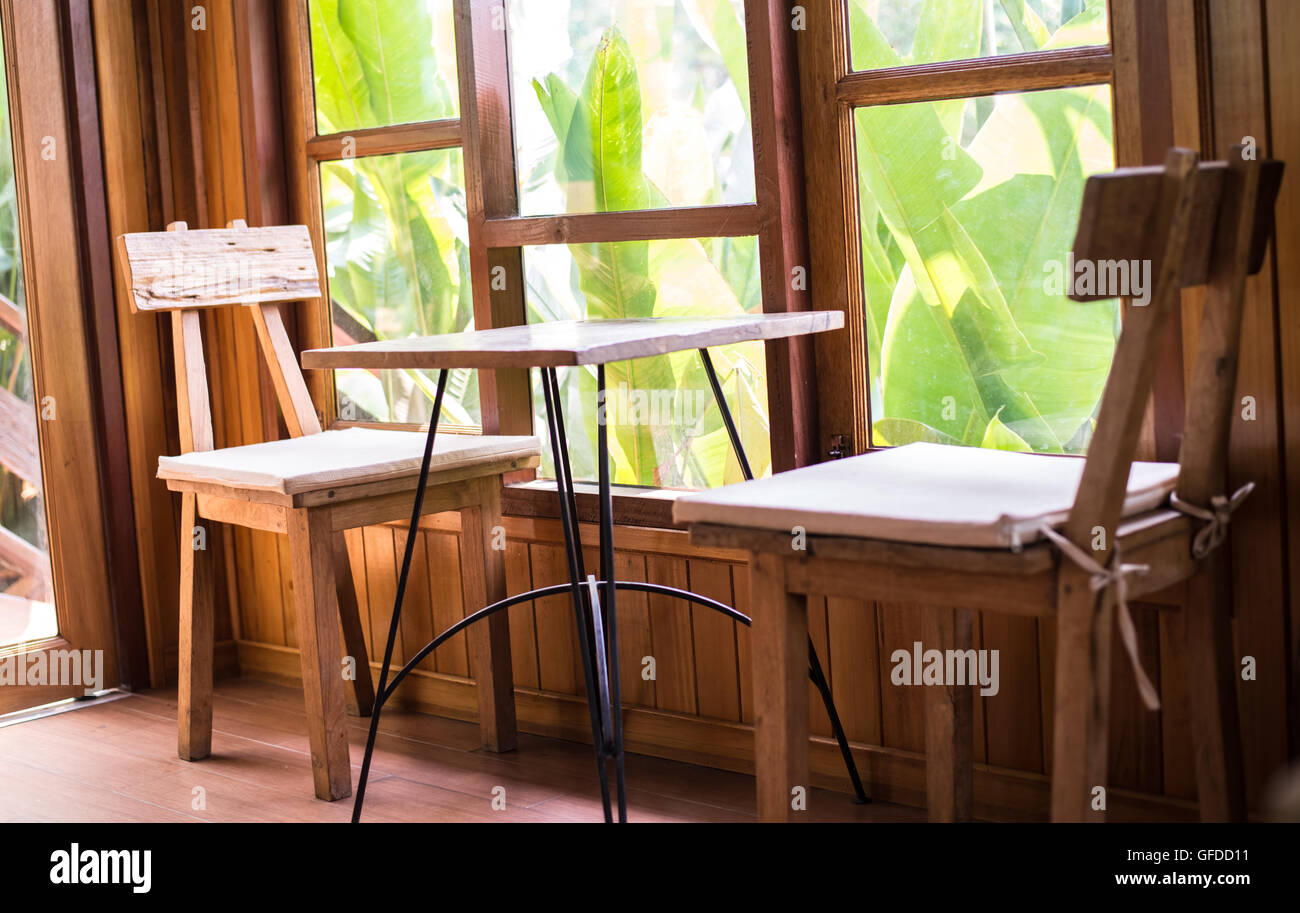 Wooden tables and chairs in a coffee shop Stock Photo - Alamy