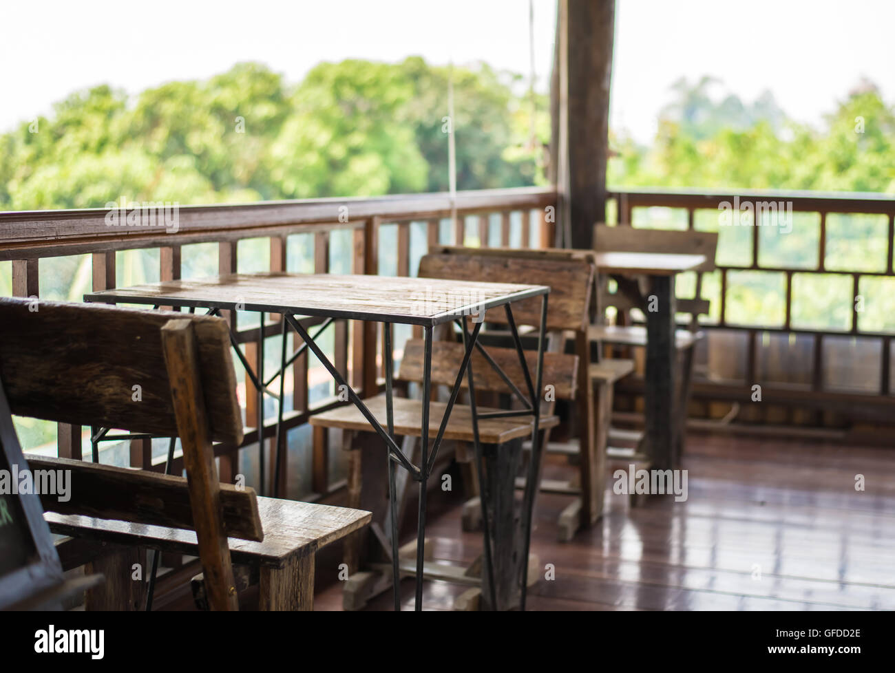 Wooden tables and chairs in a coffee shop Stock Photo - Alamy