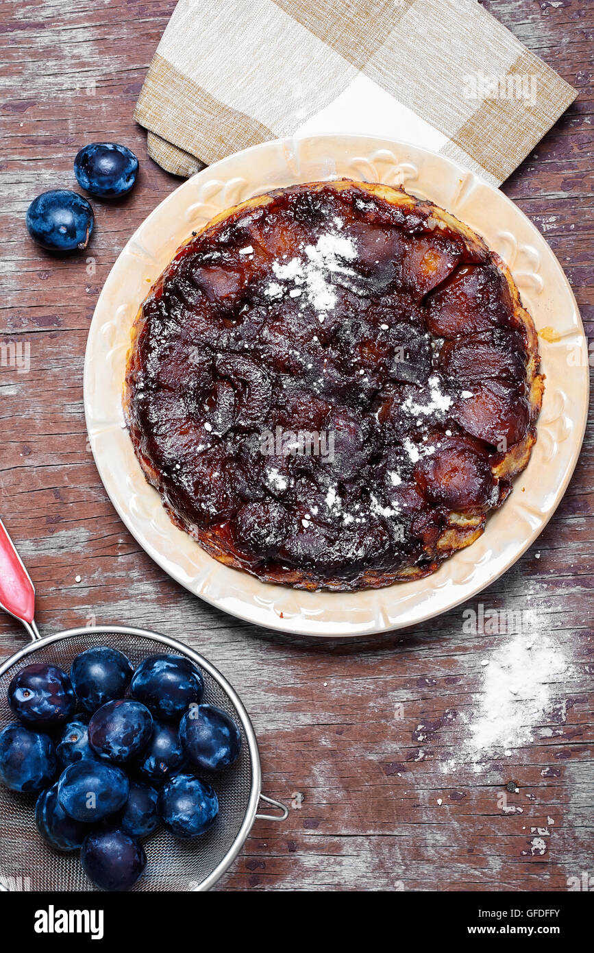 Homemade sweet cake with crop of plums in rustic style Stock Photo - Alamy