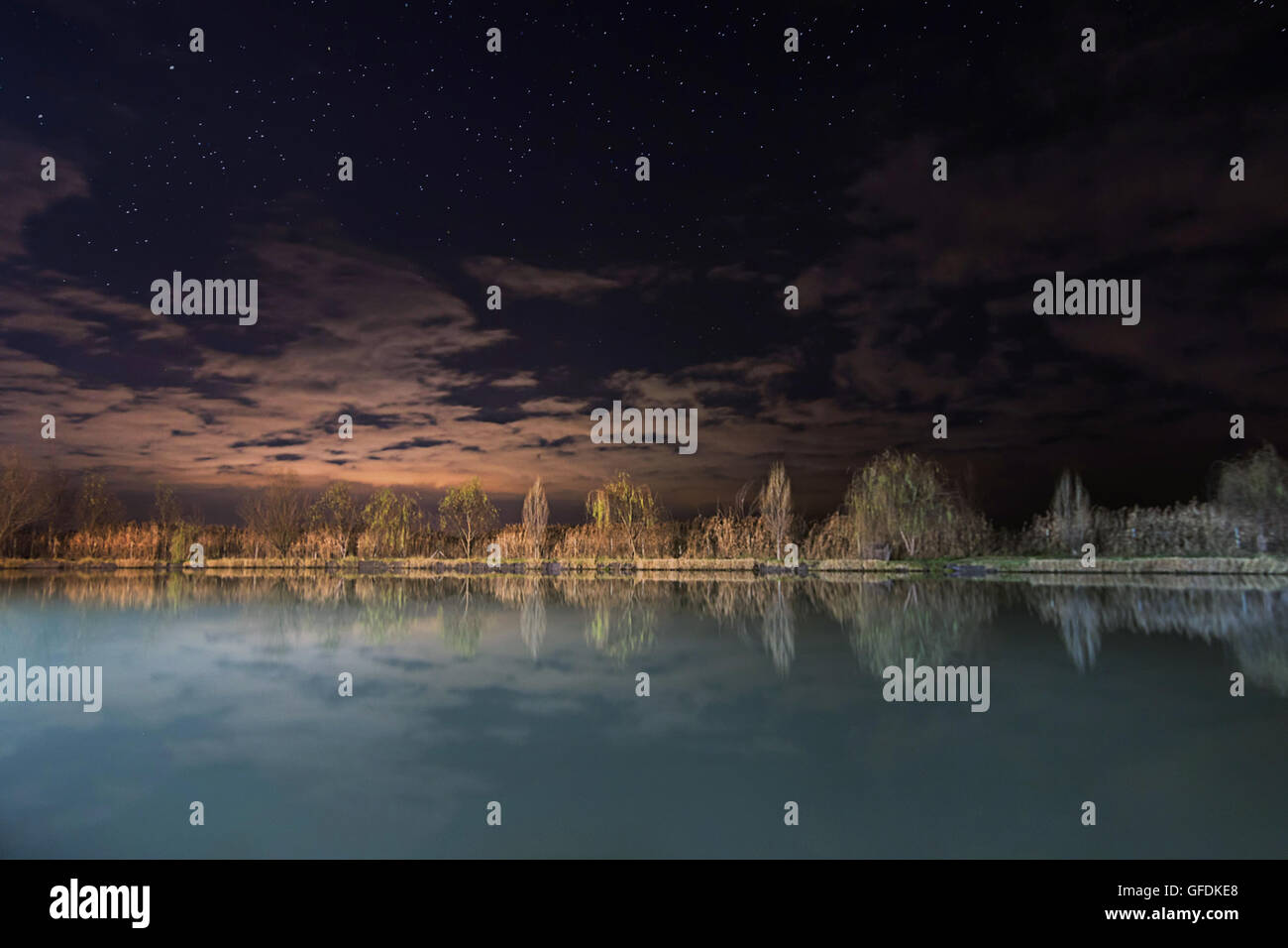 Colorful night over lake, Cloudscape reflection on lake Stock Photo - Alamy