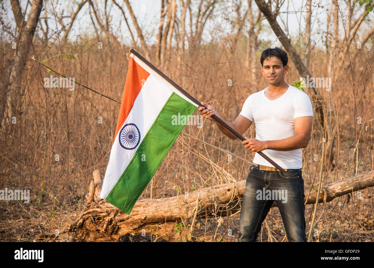 indian young man holding and waving indian flag, conceptual image for ...