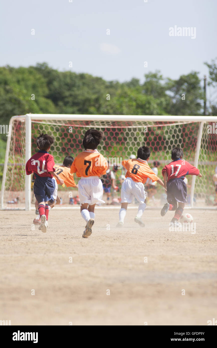 Boy with soccer shoes hi-res stock photography and images - Alamy