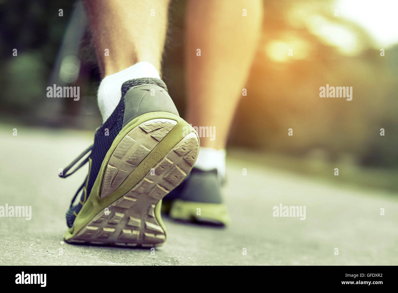 Athlete runner feet running on road closeup on shoe. Man fitness ...