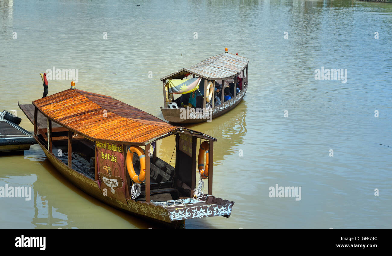 Kuching, Malaysia. Traditional boats on Sarawak river from waterfront ...