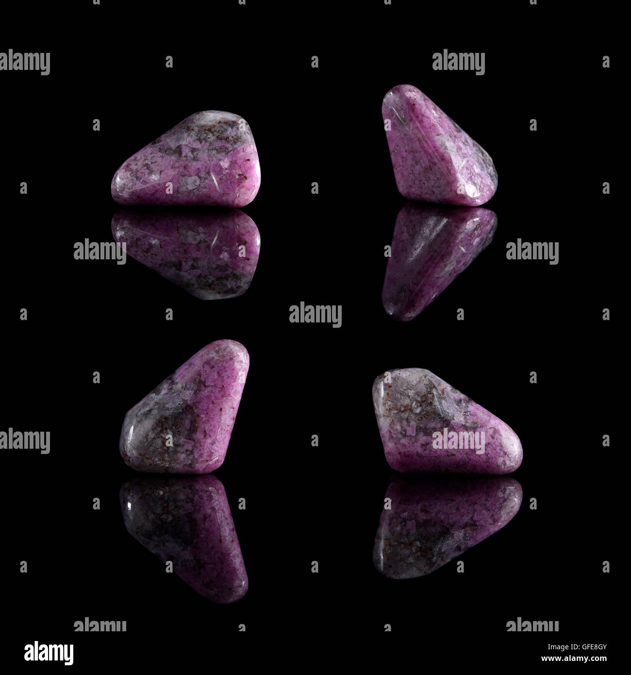 Sample of a beautiful Ruby in Cordierite tumbled specimen over black background Stock Photo - Alamy