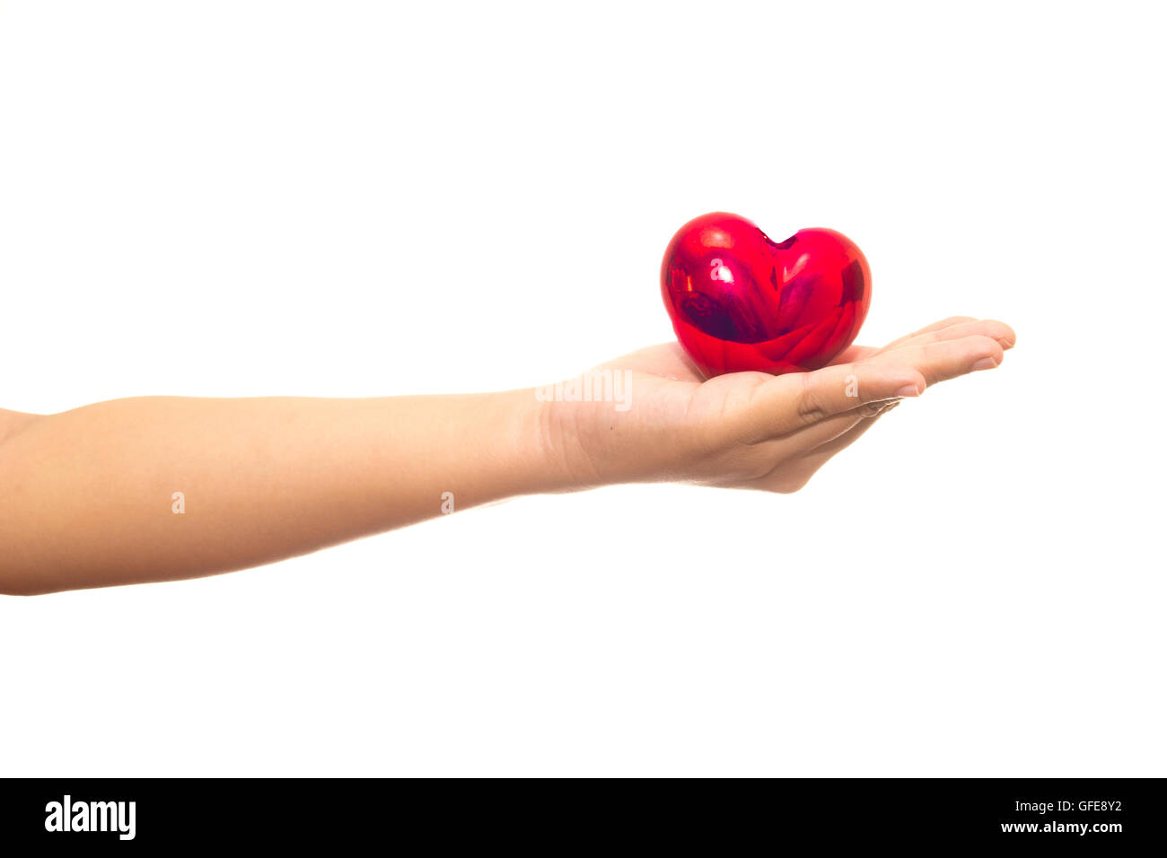 Heart in the hands isolated Stock Photo - Alamy