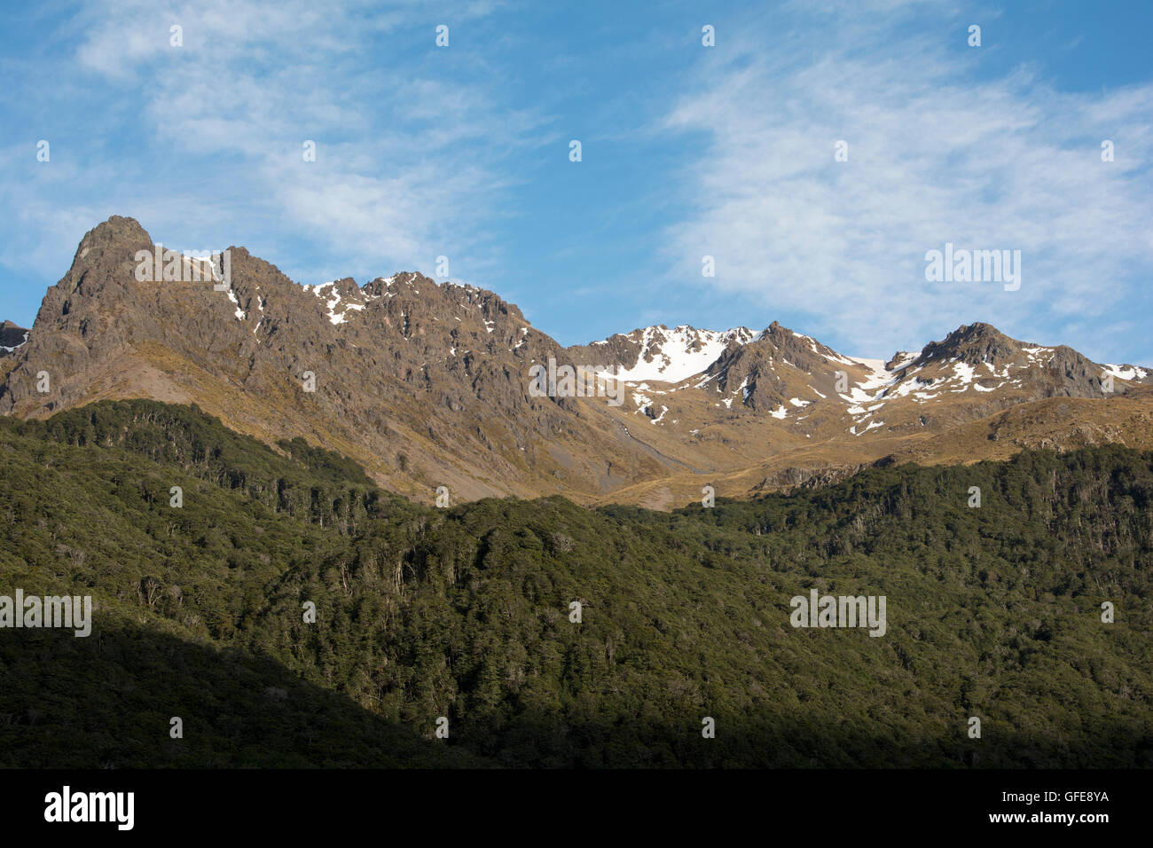 The morning sun colors the Livingstone Mountains in the Southern Alps ...