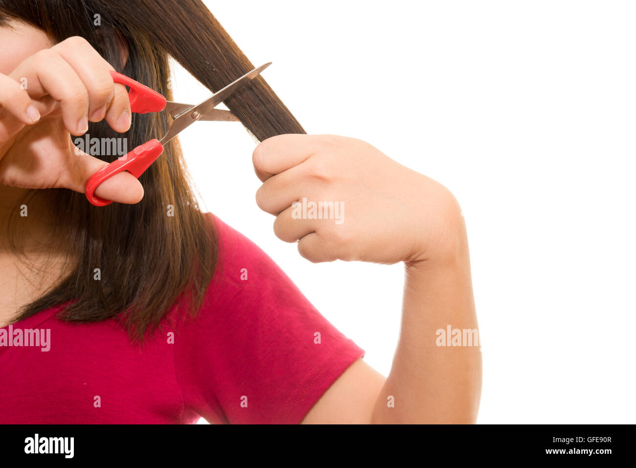 woman cutting her hair with scissors - unhappy expression, isolated on ...