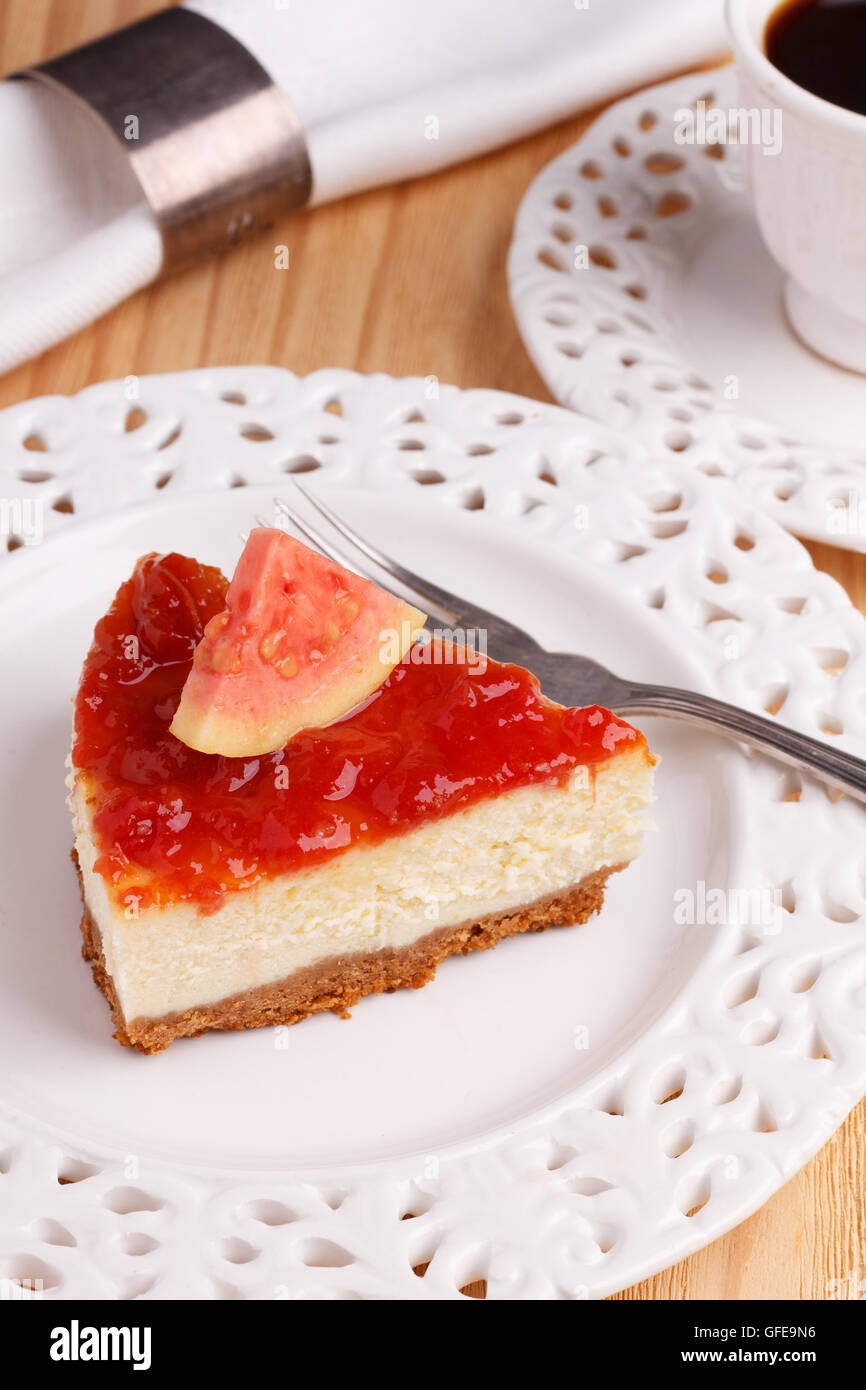 Cheesecake with brazilian goiabada jam of guava on white vintage plate ...