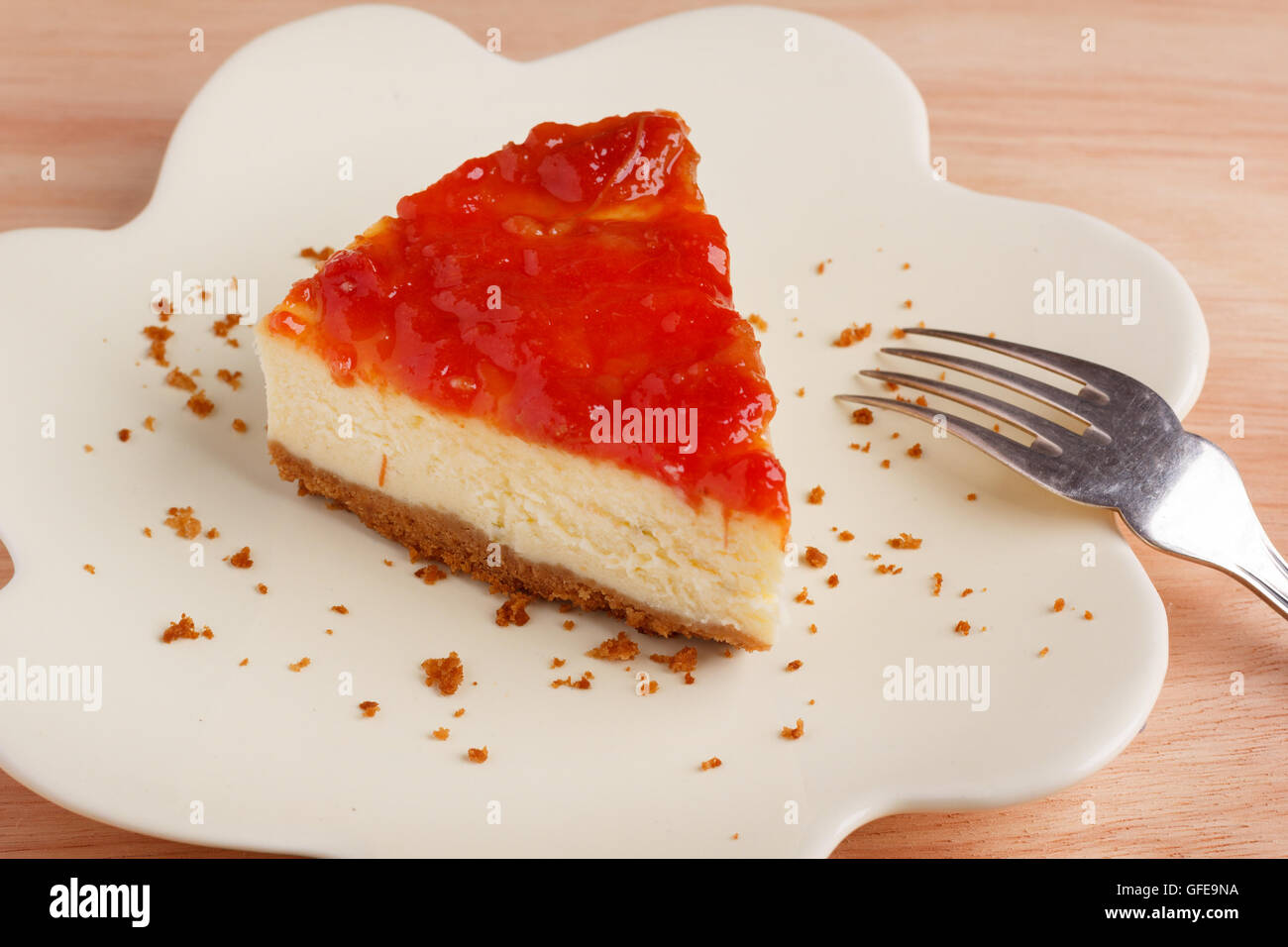 Cheesecake with brazilian goiabada jam of guava on plate on wooden ...