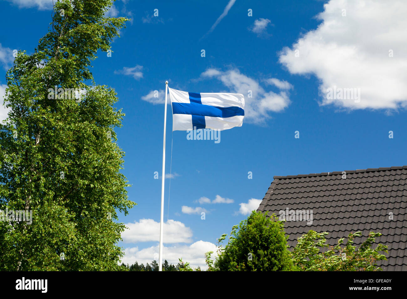 Flag of Finland on blue sky background Stock Photo - Alamy