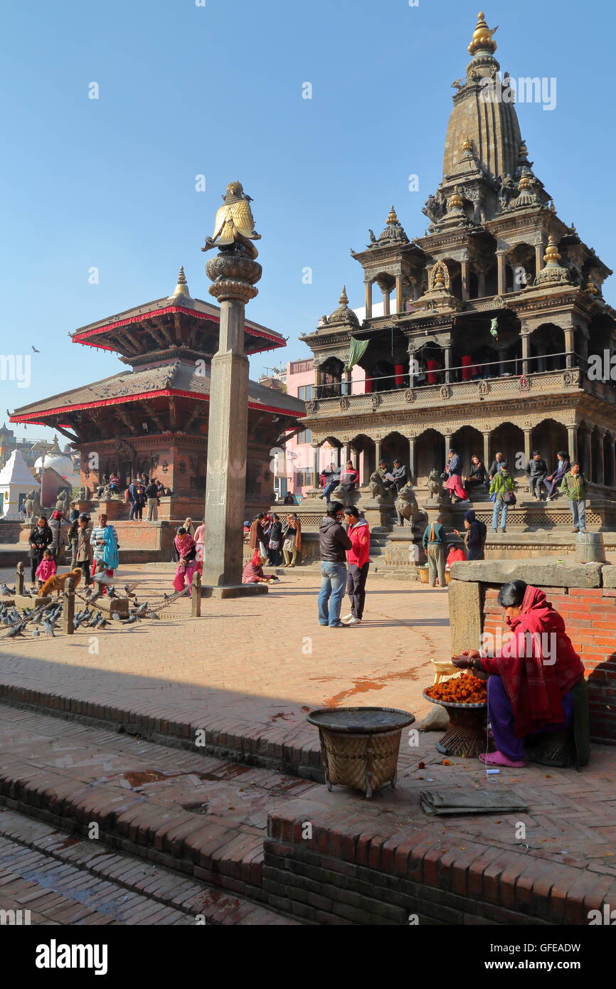 Garuda statue on column and Krishna Mandir temple at Durbar Square ...