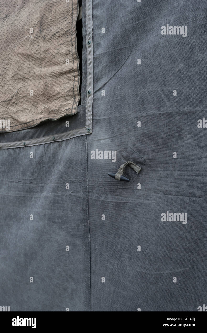 Canvas field tent section, showing window mesh and fixing toggle Stock ...