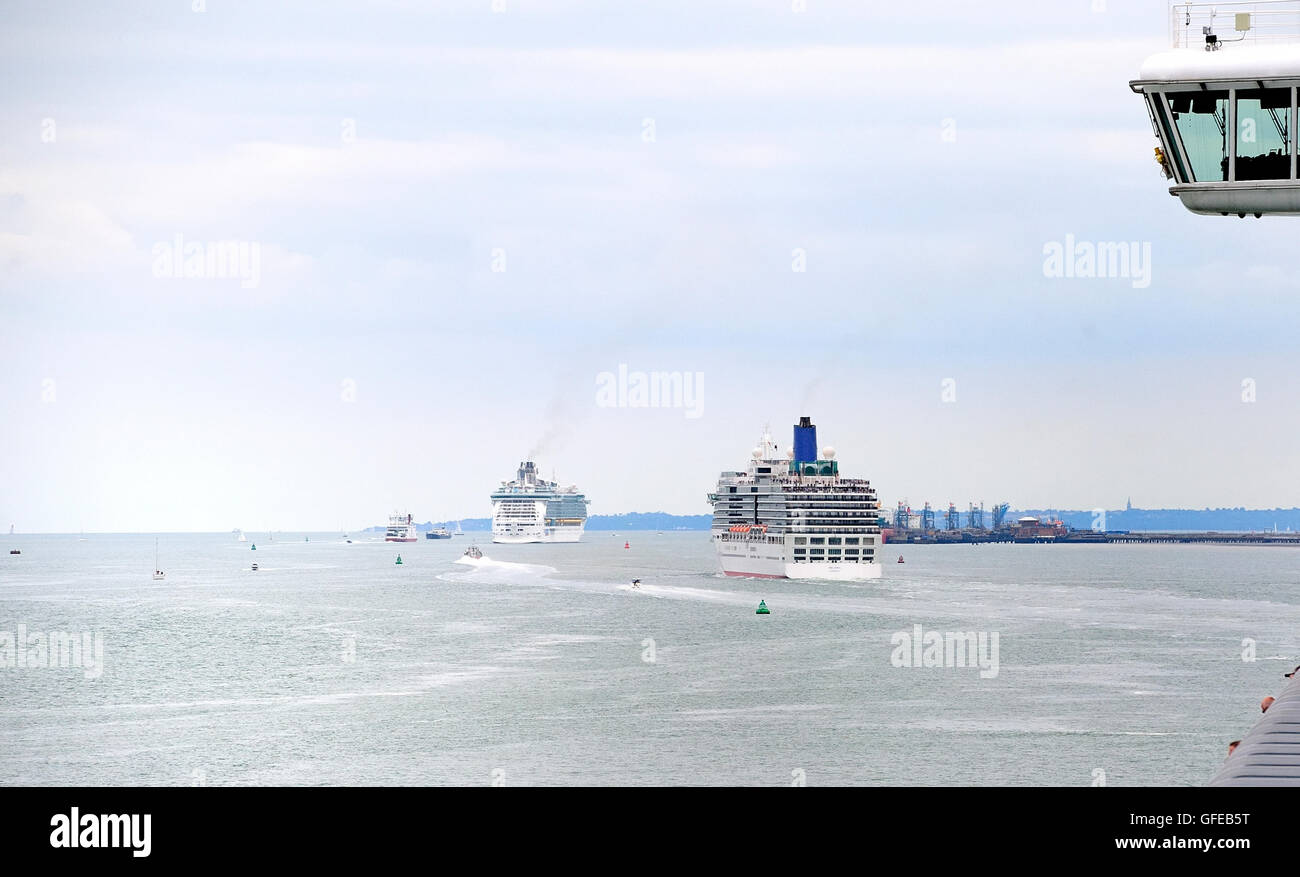 Cruise Ships steaming line a stern Stock Photo - Alamy