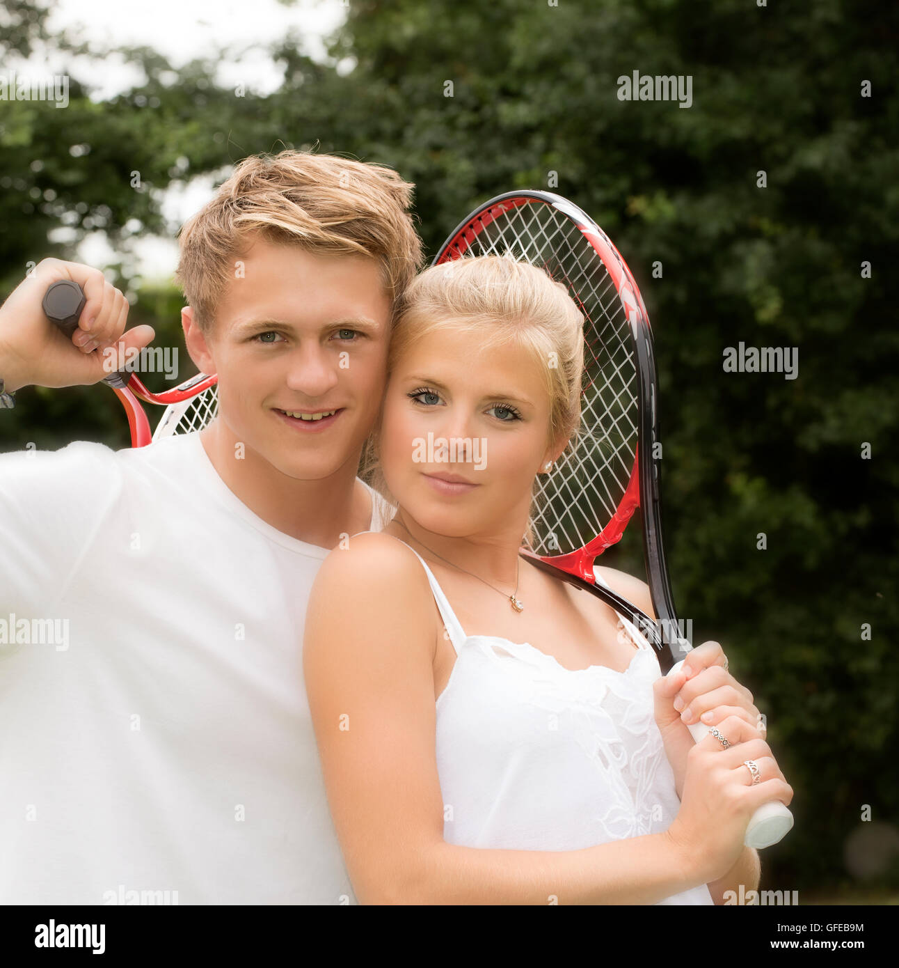 Two teens holding tennis rackets hi-res stock photography and images ...