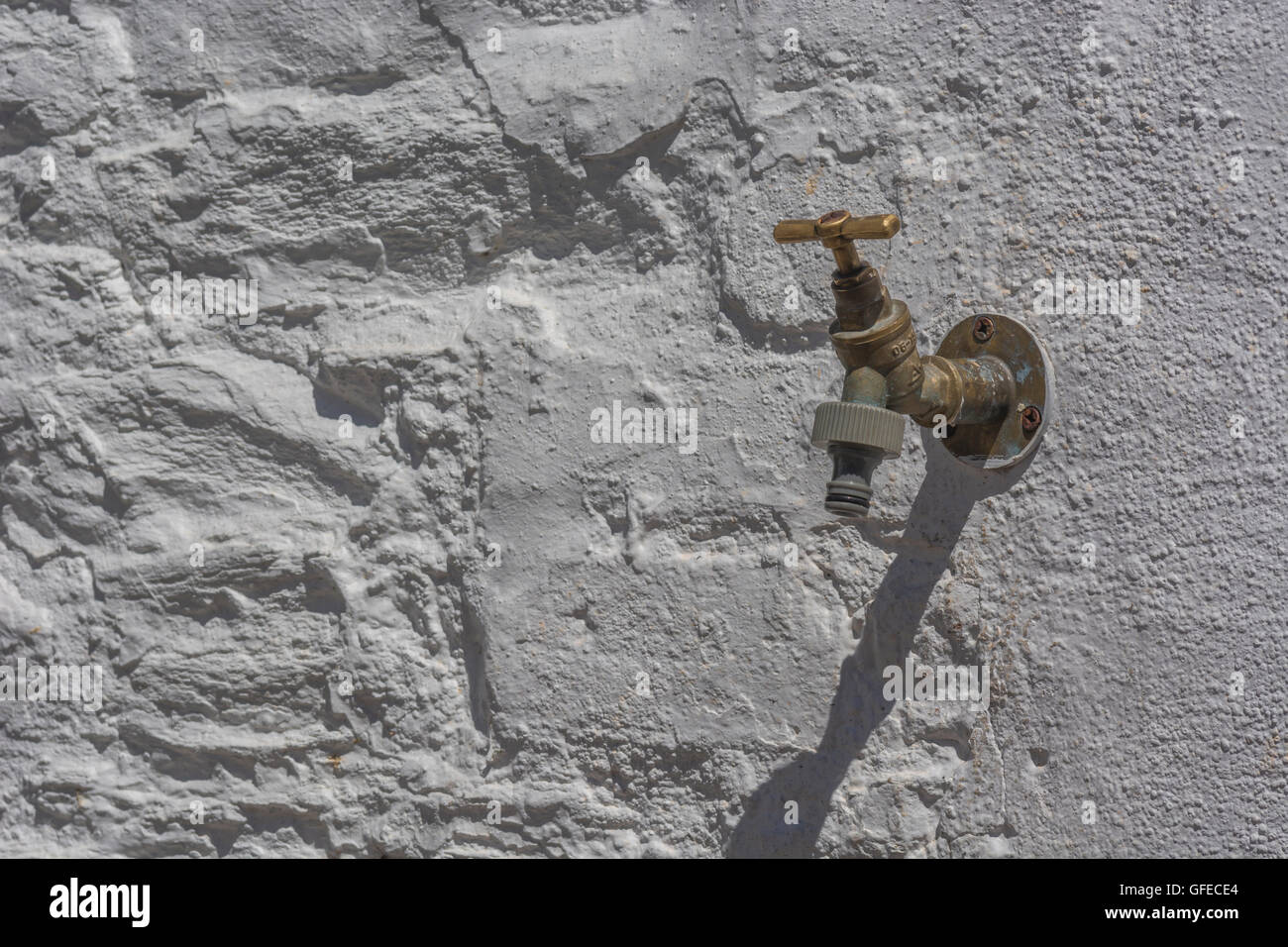 Brass garden tap / outside tap on external building wall - for concept ...