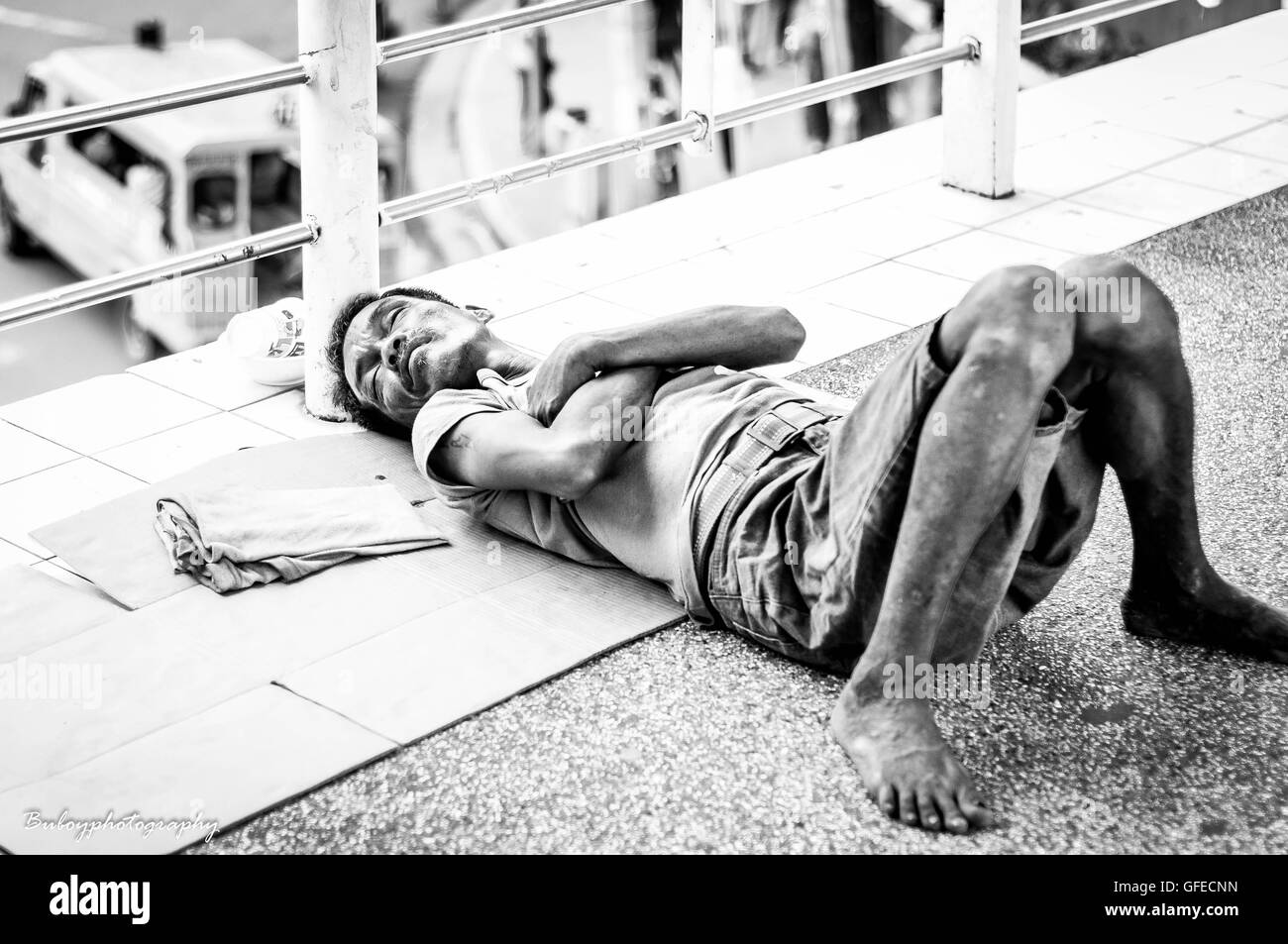 old man taking a rest on the sidewalk Stock Photo - Alamy