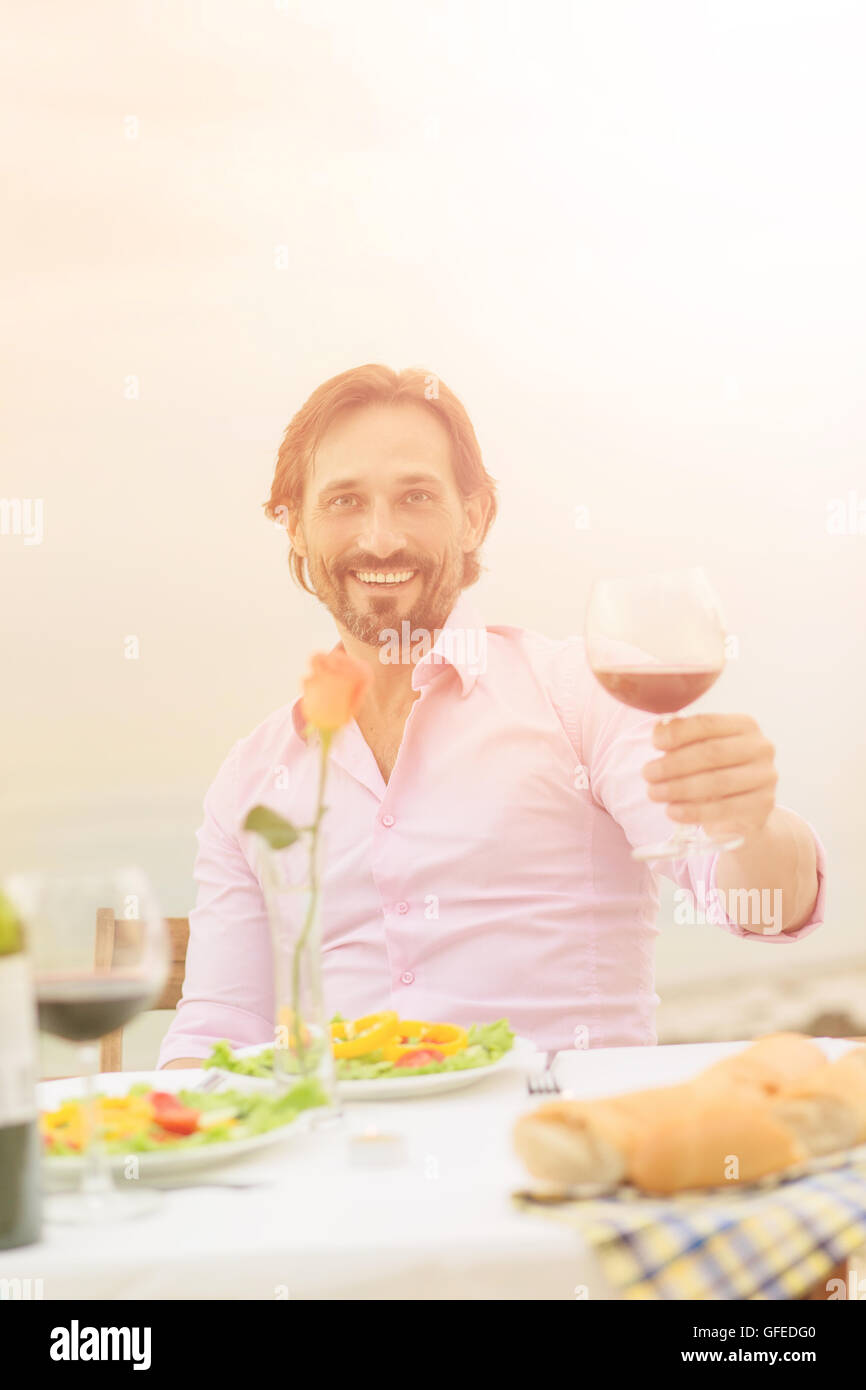 Handsome man drinking wine Stock Photo - Alamy