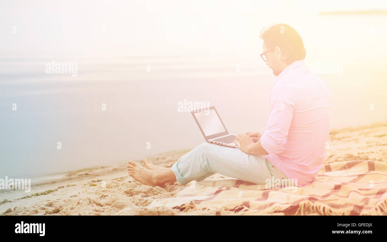 Writer with laptop Stock Photo - Alamy