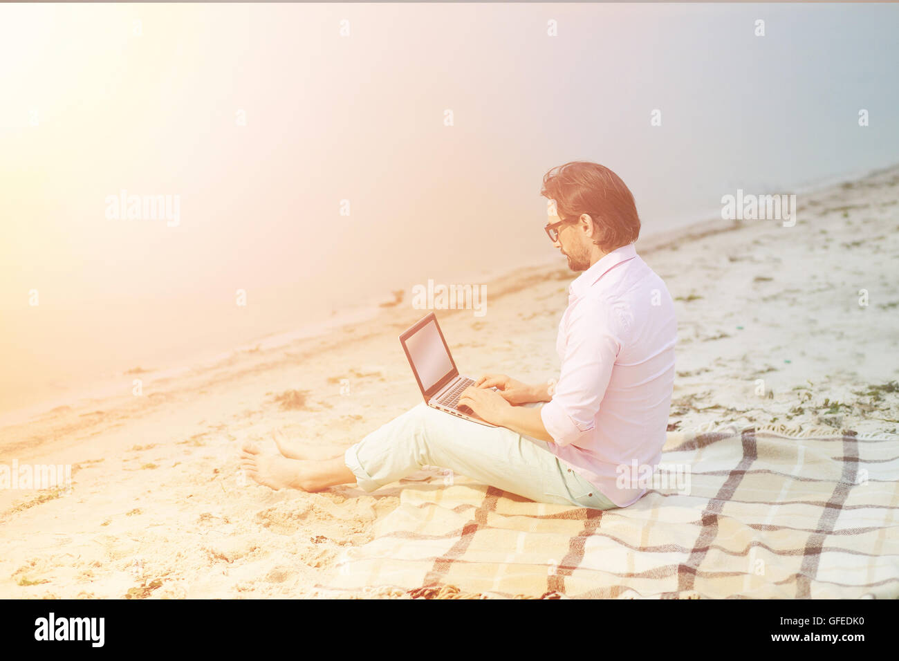 Writer with laptop Stock Photo - Alamy