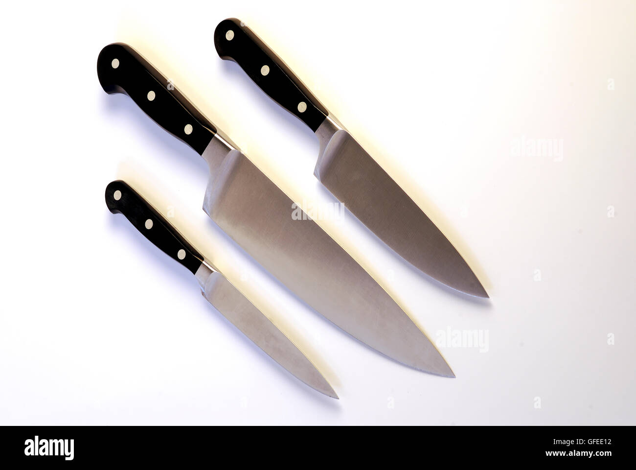 set of three Kitchen Knives on white background Stock Photo - Alamy