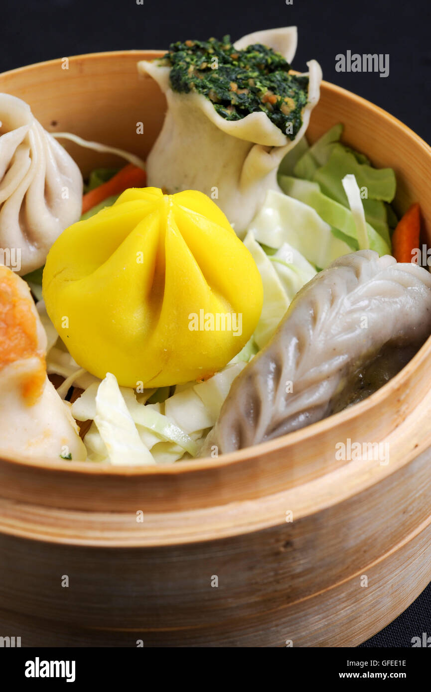 Chinese Dumplings in Bamboo Steamer Stock Photo - Alamy